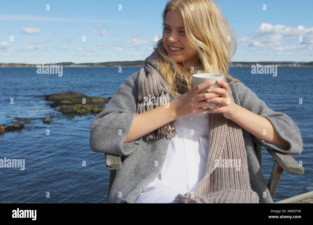 Young Woman drinking Coffee or Tea Stock Photo - Alamy