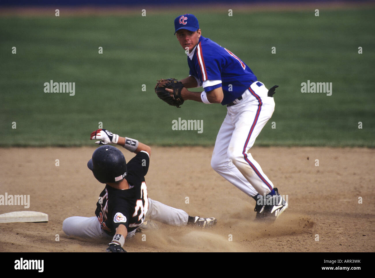 Baseball players in action Stock Photo - Alamy