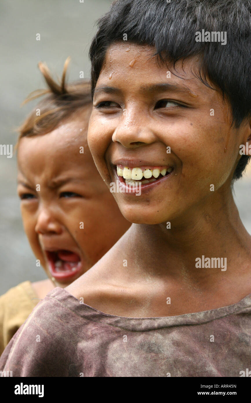 "Nepalese girl with a crying baby Stock Photo - Alamy
