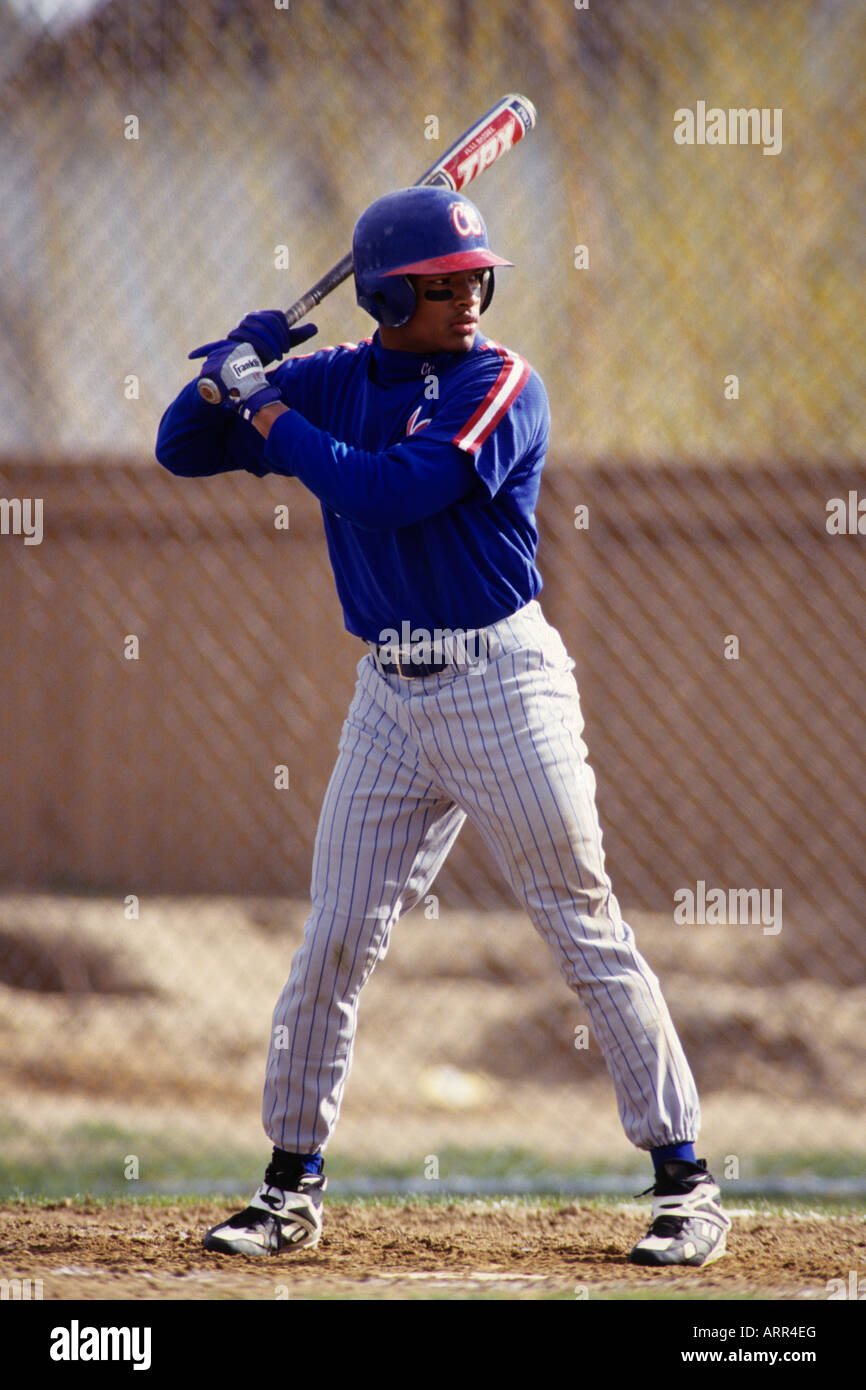 Baseball player in action batting Stock Photo - Alamy