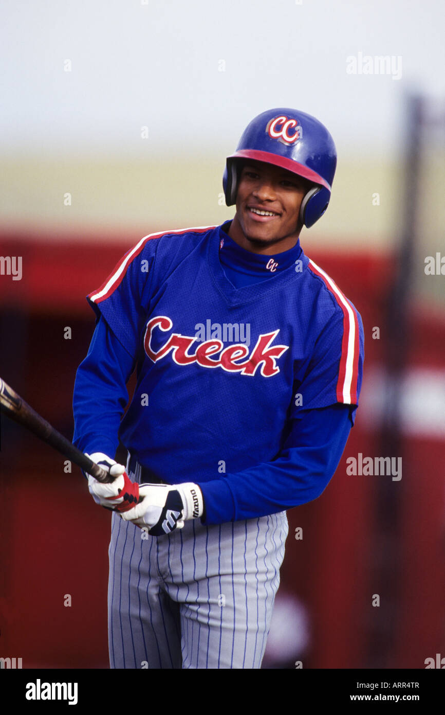 Baseball player in action batting Stock Photo - Alamy