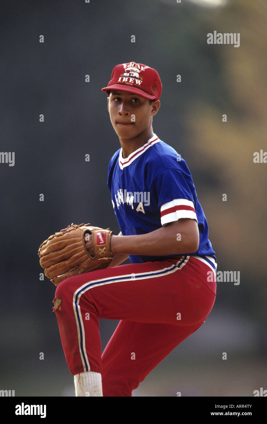 Young baseball pitcher in action Stock Photo - Alamy