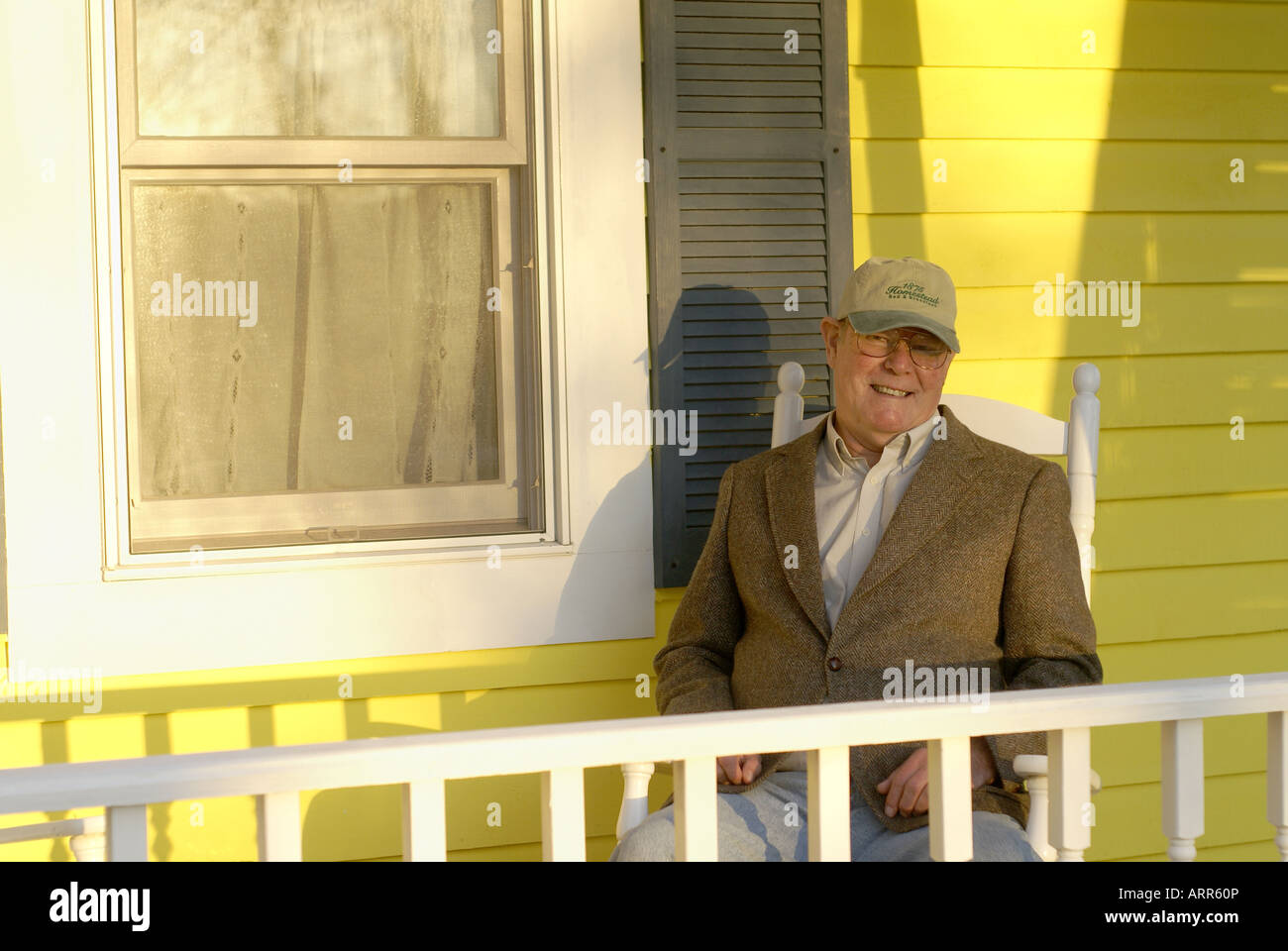 Man Sitting on Porch Stock Photo - Alamy
