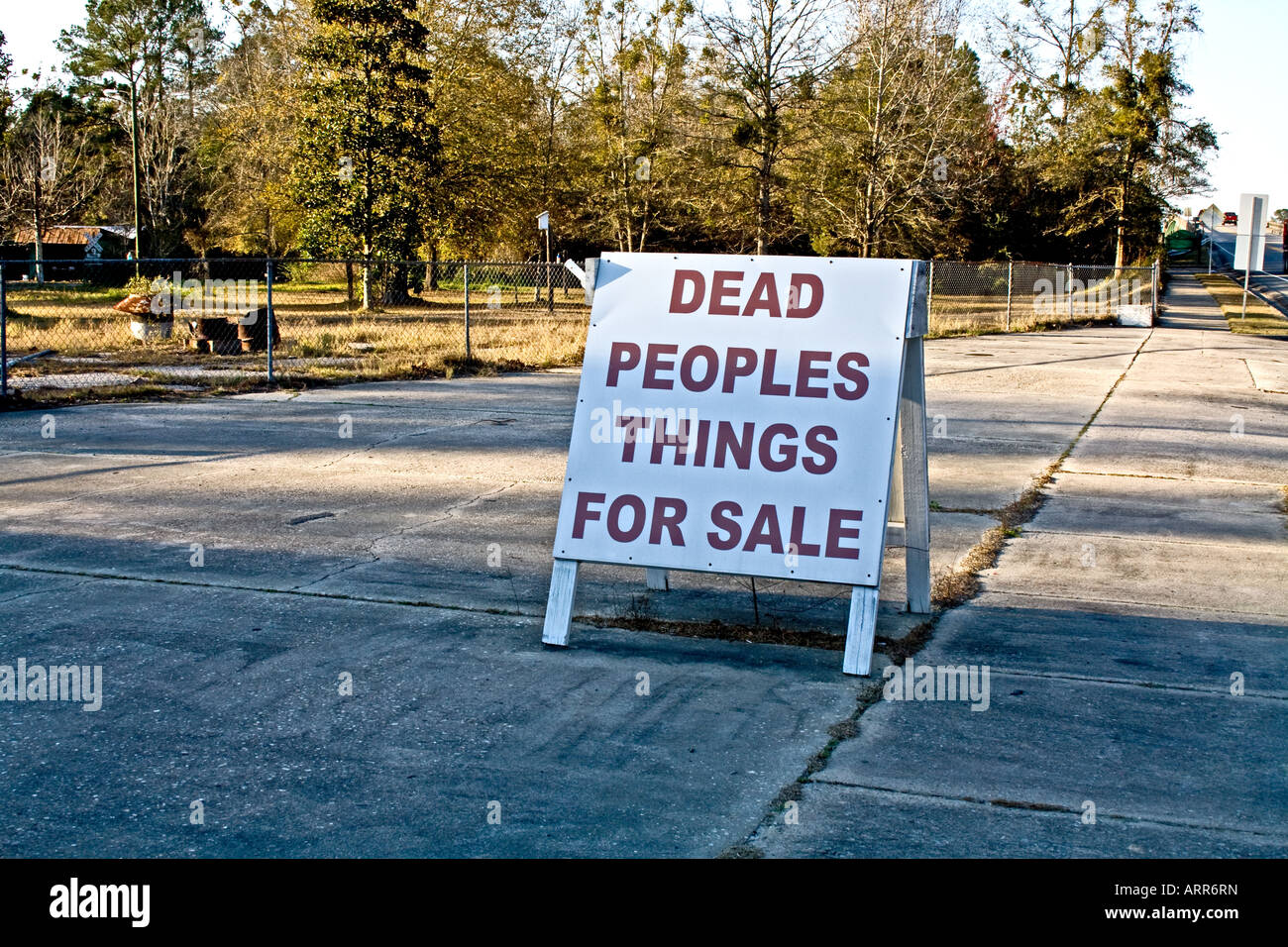 Sign on a sidewalk by an antique shop Stock Photo - Alamy