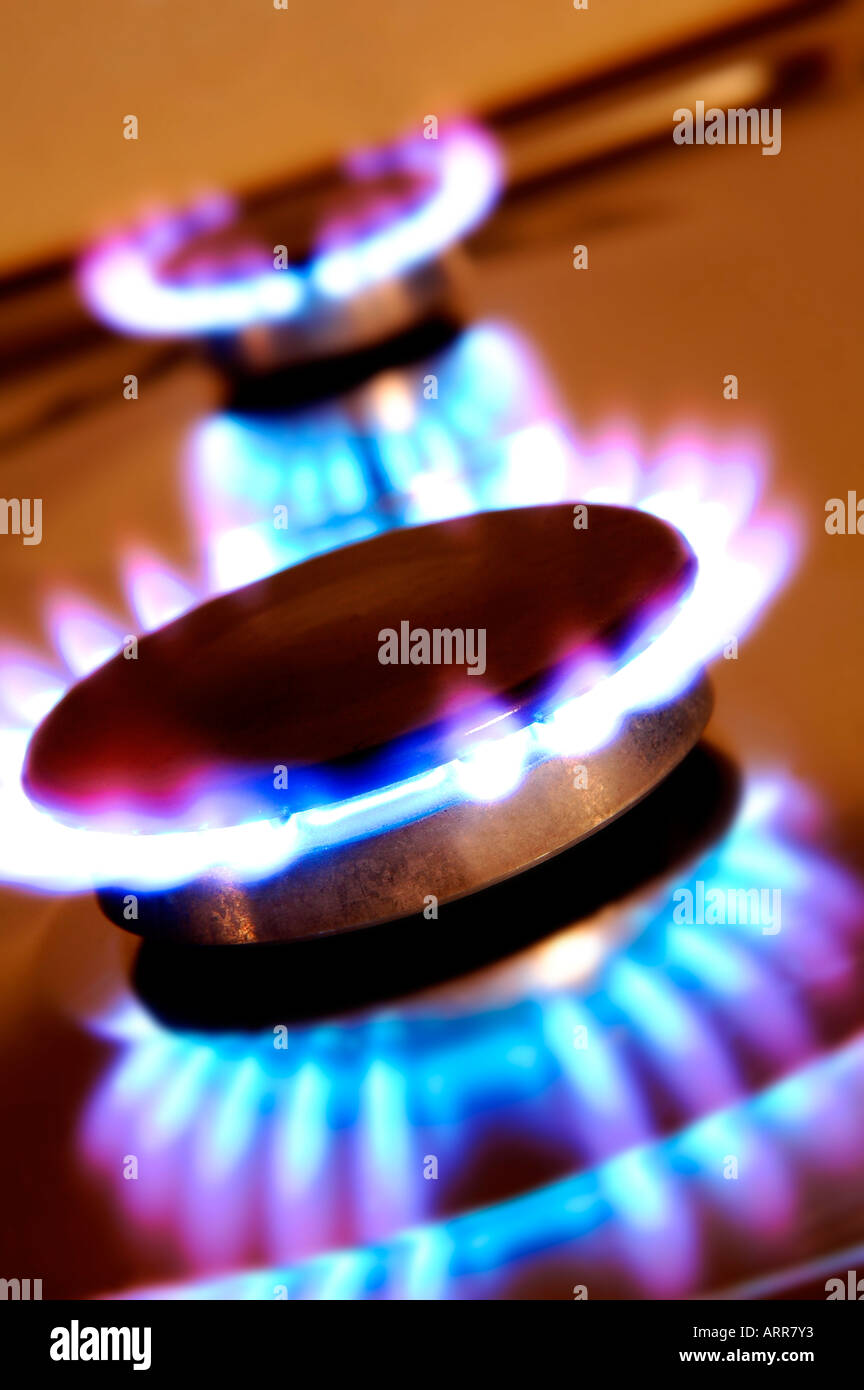 two kitchen gas flames burning Stock Photo - Alamy