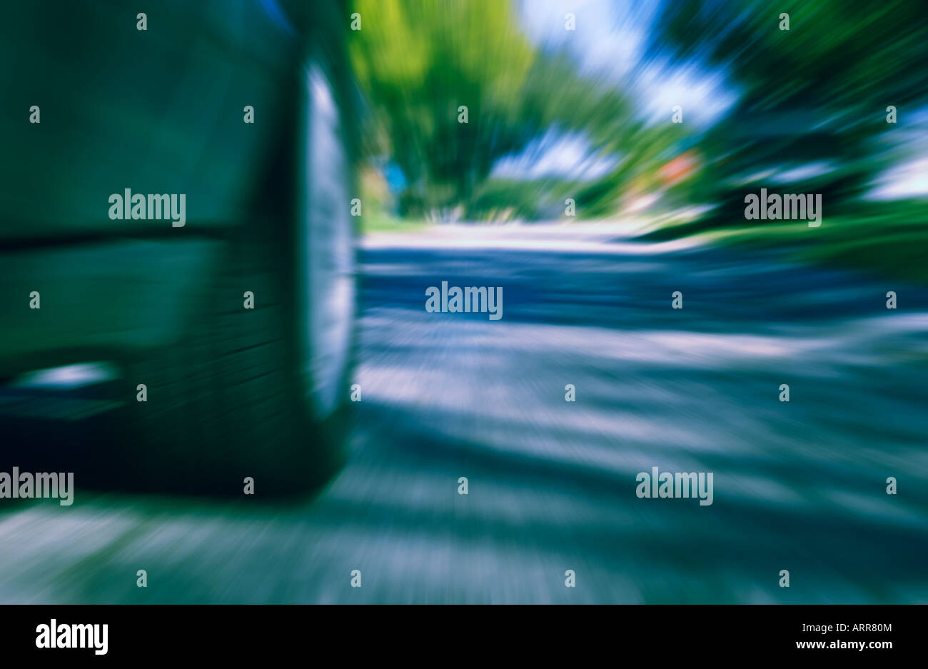 car speeding on residential street Stock Photo - Alamy
