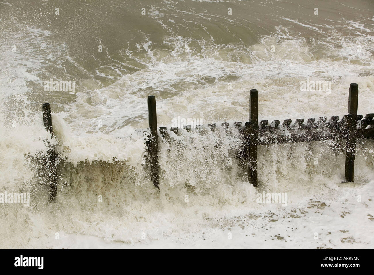 storm waves breaching the sea defences at Happisburgh, Norfolk, UK ...