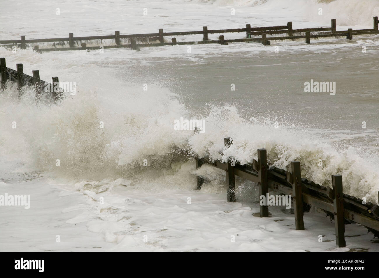 storm waves breaching the sea defences at Happisburgh, Norfolk, UK ...