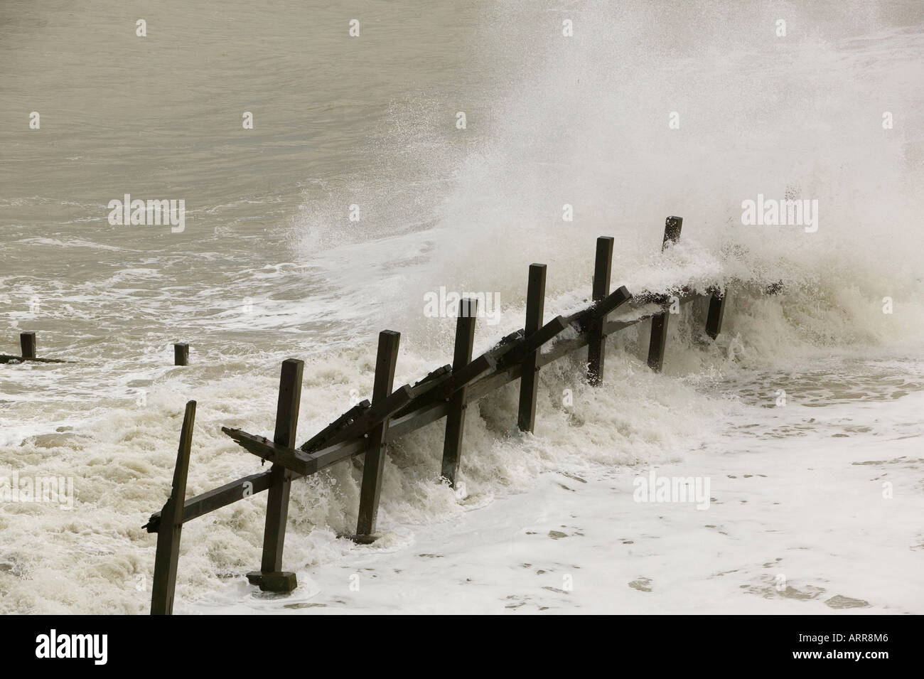 storm waves breaching the sea defences at Happisburgh, Norfolk, UK ...