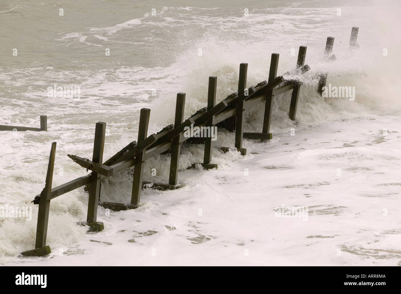 storm waves breaching the sea defences at Happisburgh, Norfolk, UK ...