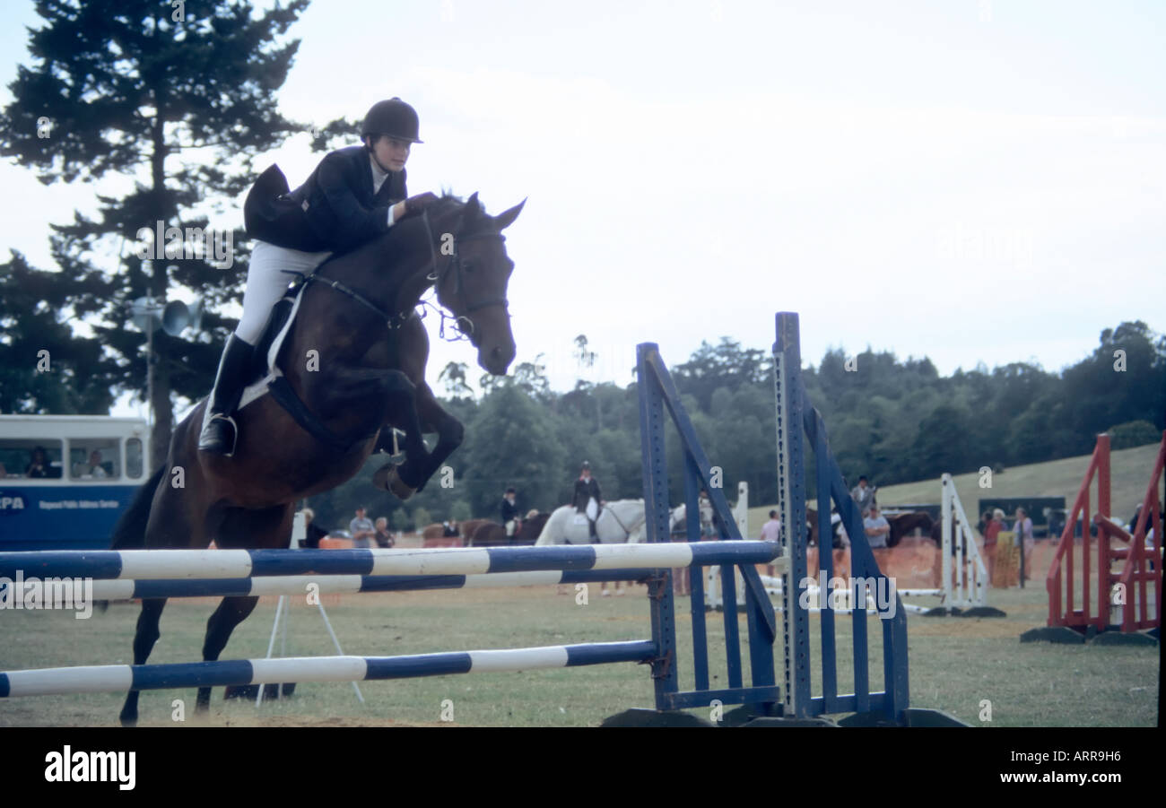 Young girl showjumping Stock Photo - Alamy