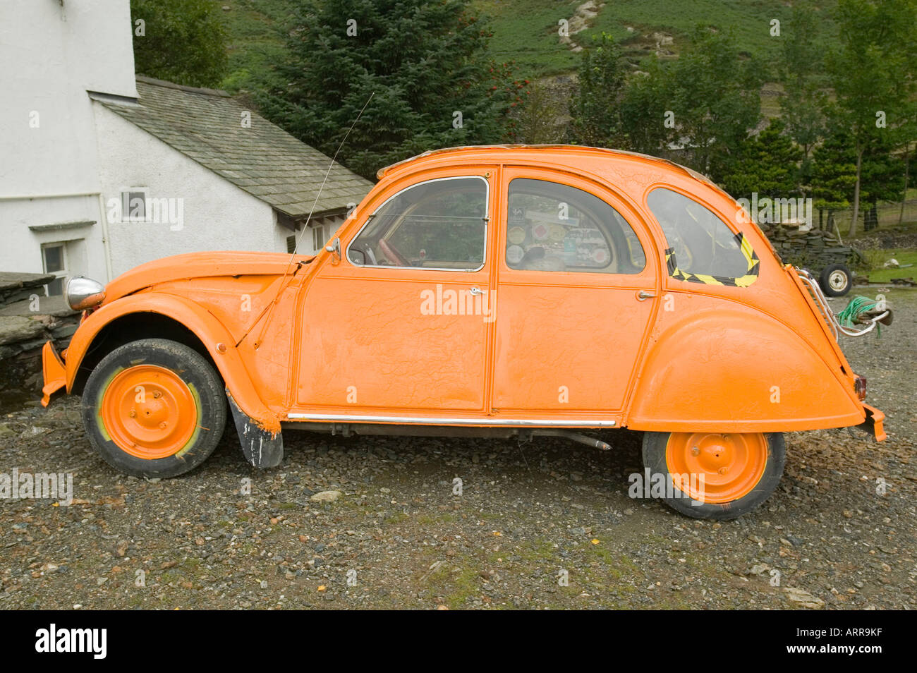 a customized citroen 2CV painted bright orange, Coniston, Lake district ...