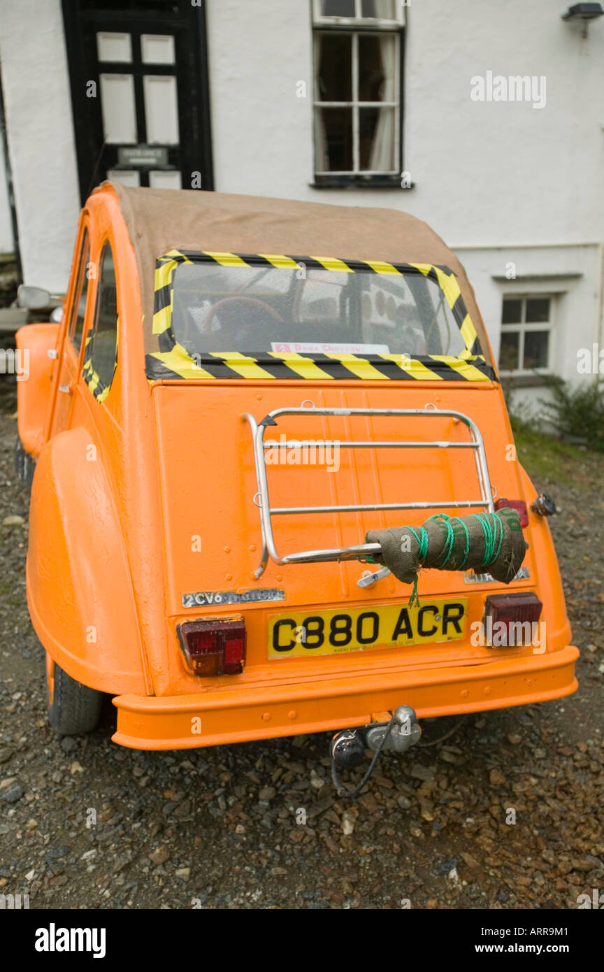 a customized citroen 2CV painted bright orange, Coniston, Lake district ...