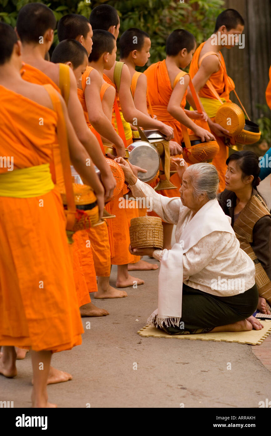 Procession of monks receiving alms Luang Prabang Laos Stock Photo - Alamy