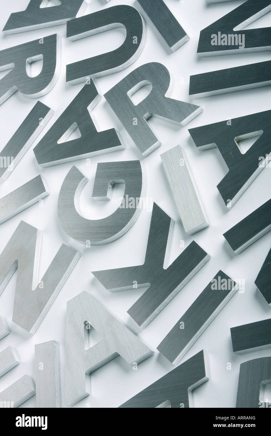 Stylish letters cut out of polished steel Stock Photo - Alamy