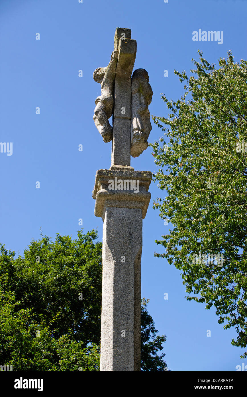 stone cross on a platform with steps and sculpted the crucifix that is ...