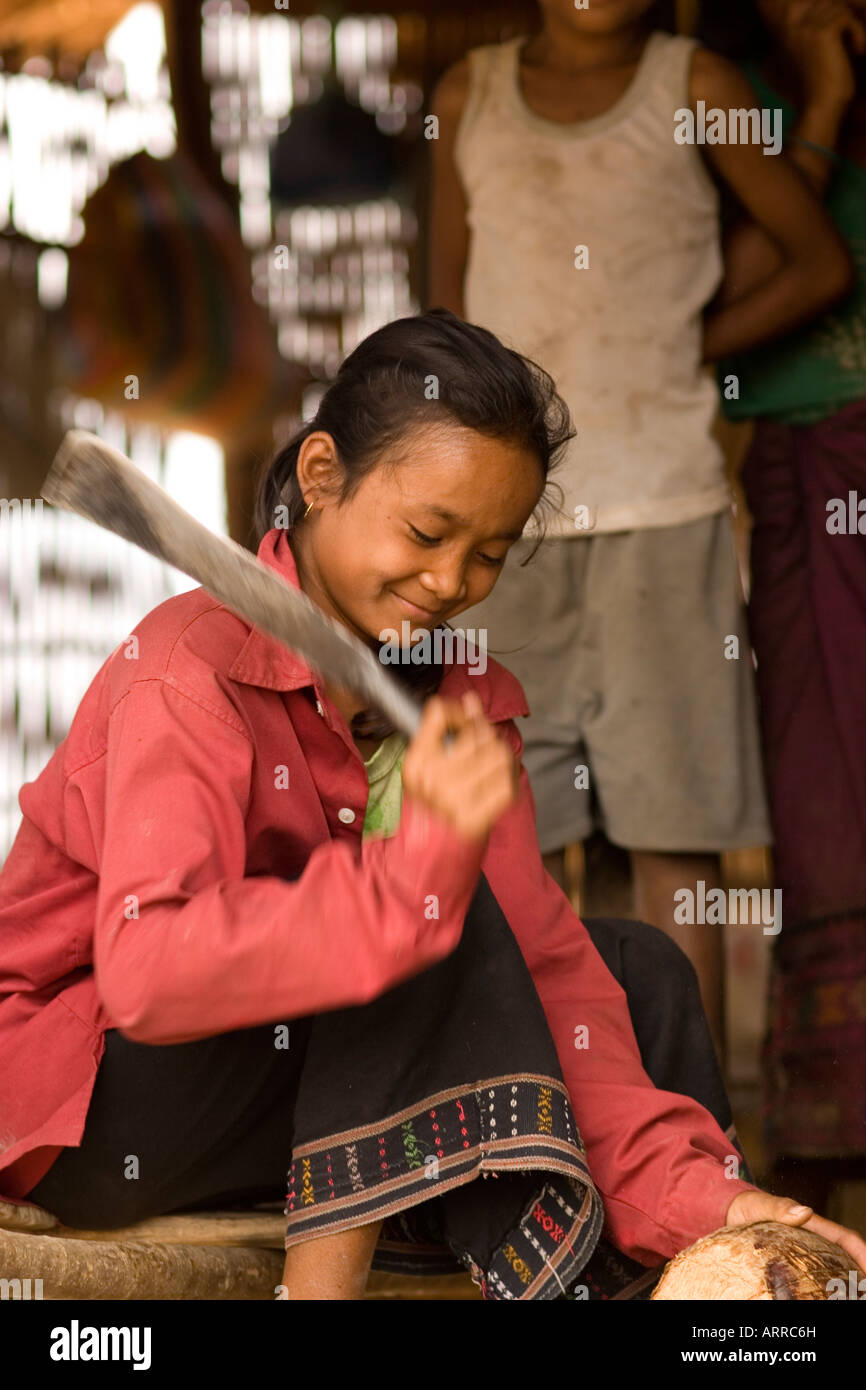 Girl chops coconut Attapeu province Laos Stock Photo - Alamy