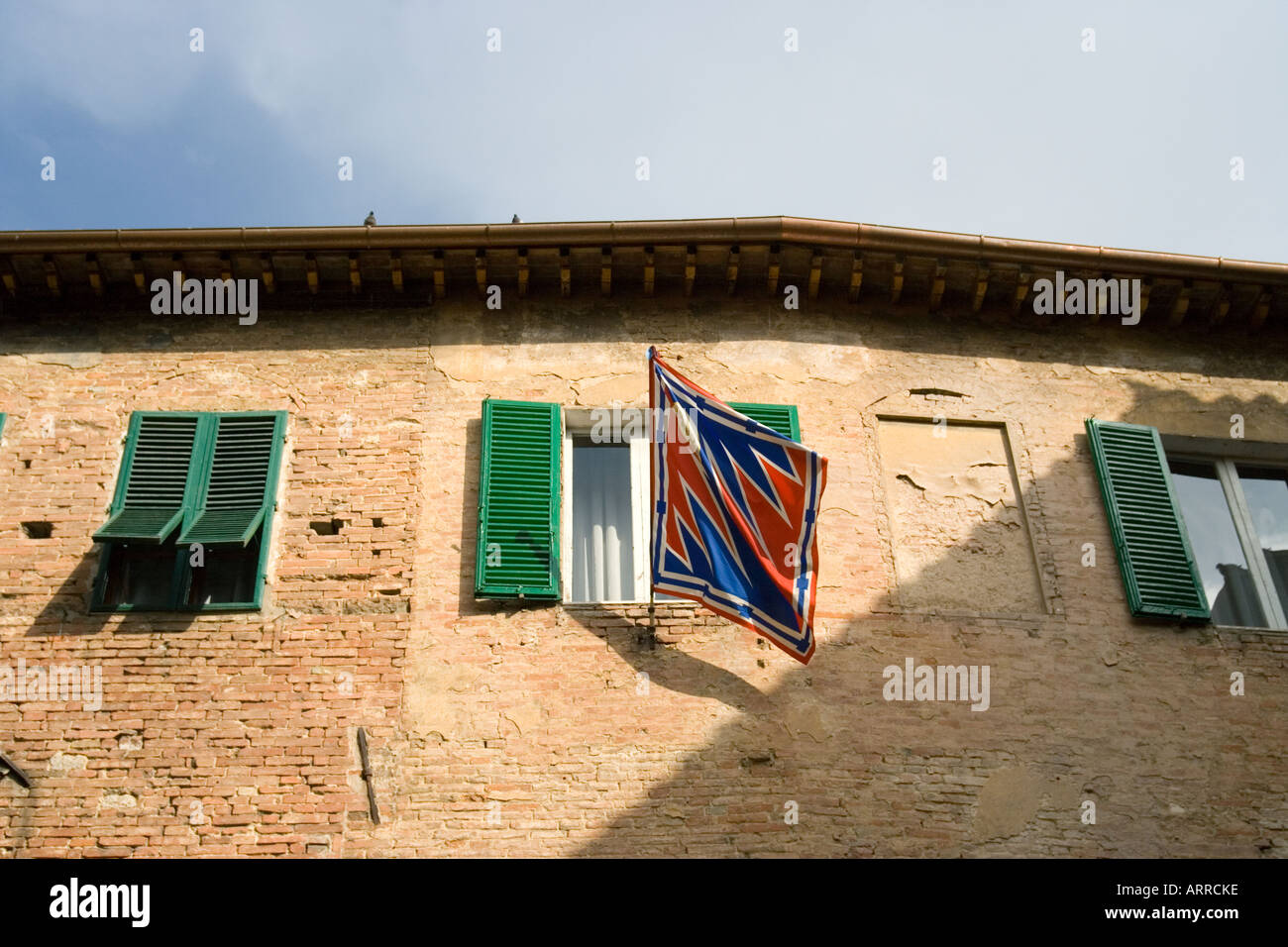 Siena Tuscany Italy ancient walled Gothic city Contrada flag hanging ...
