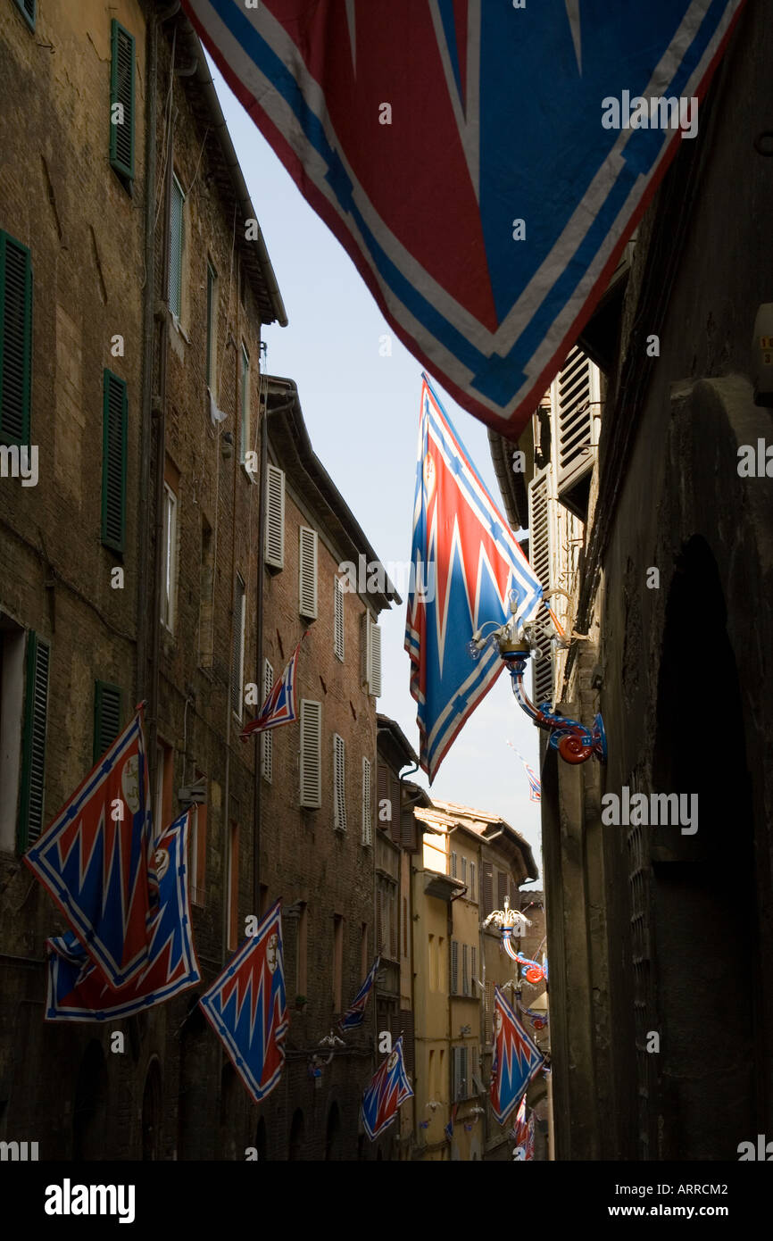 Siena Tuscany Italy ancient walled Gothic city Contrada flag and light ...