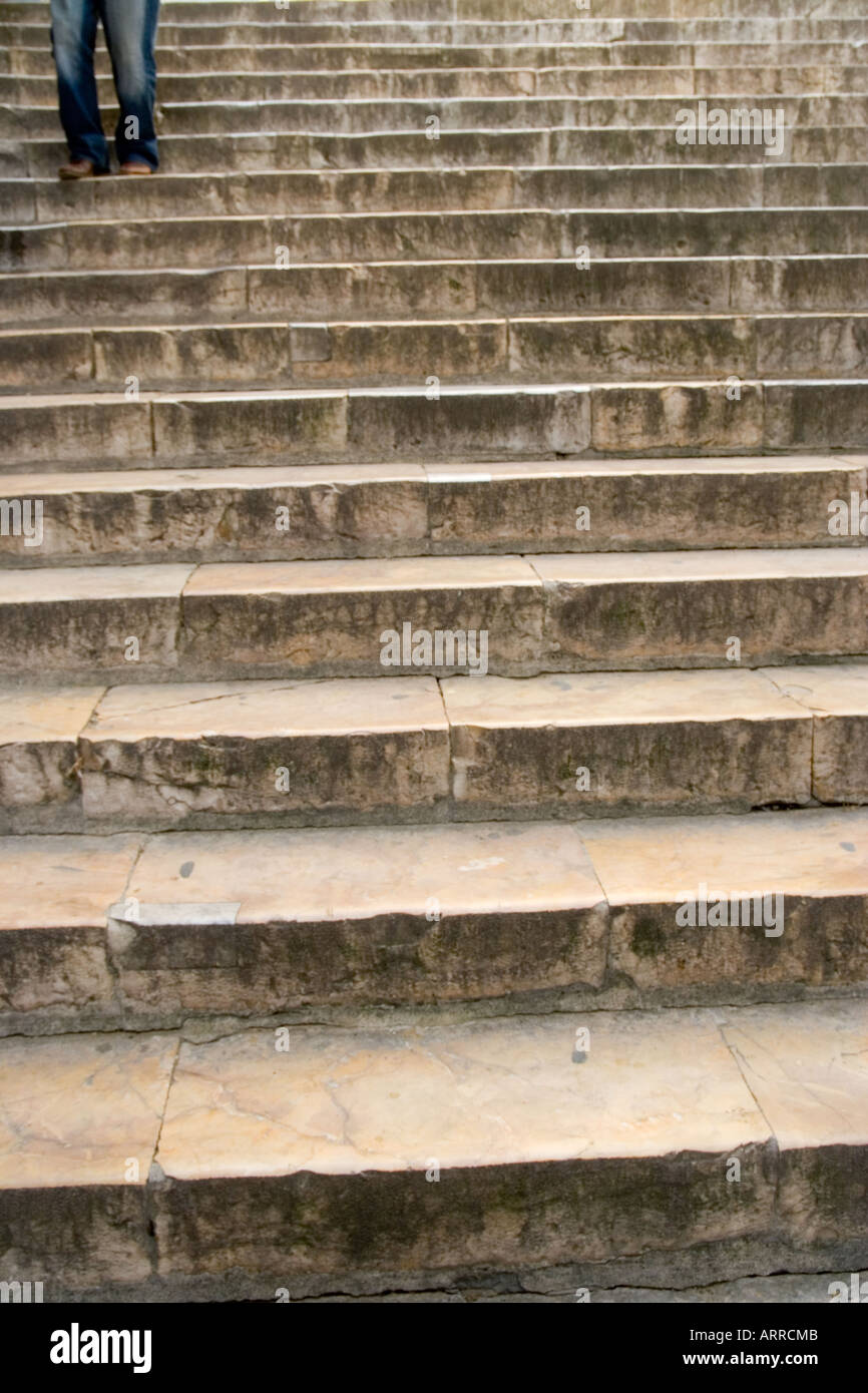 Siena Tuscany Italy ancient walled Gothic city marble steps with person ...