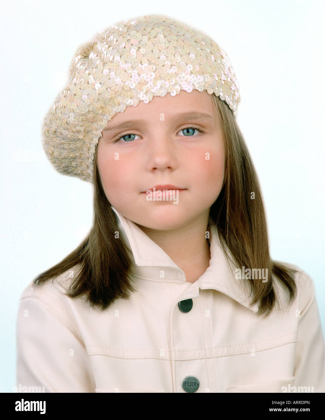 A young girl wearing makeup in a sequin beret Stock Photo - Alamy
