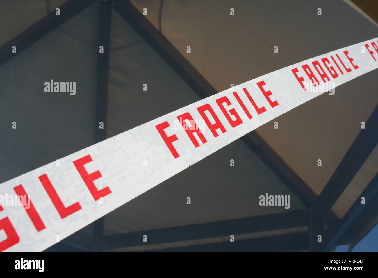 fragile tape on structure Stock Photo - Alamy