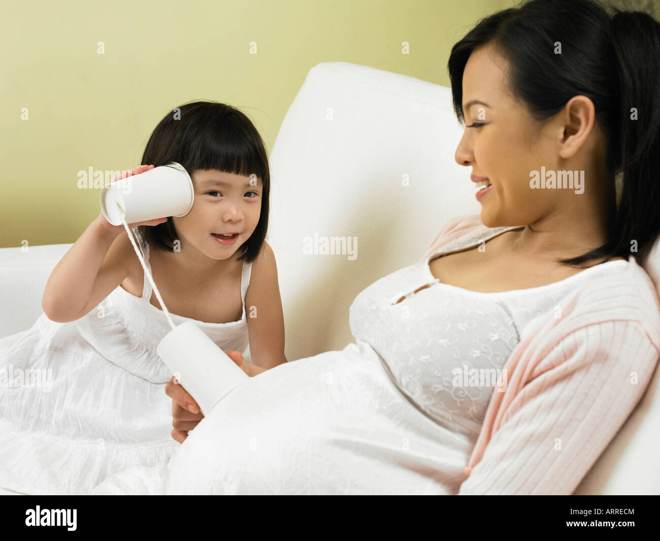 girl communicating with baby in mum tummy Stock Photo - Alamy