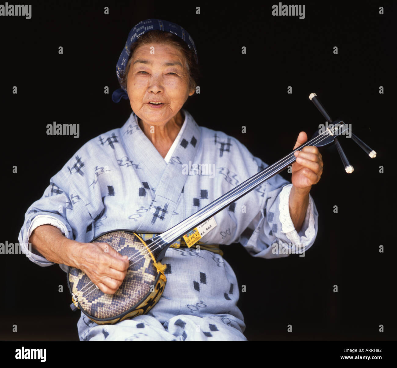 Beautiful elderly Okinawan lady wearing a traditional yukata kimono ...