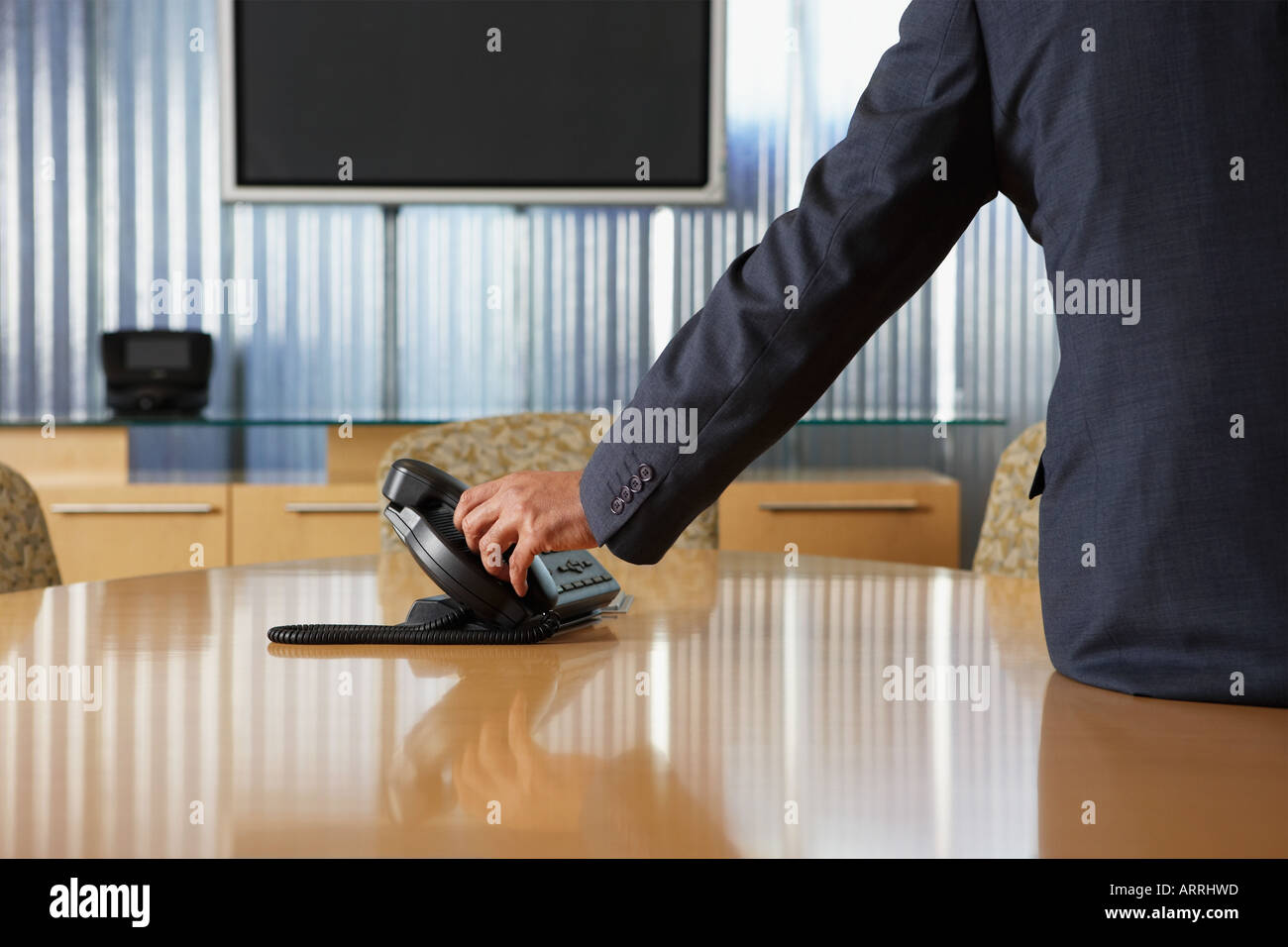 Businessman lifting telephone receiver Stock Photo - Alamy