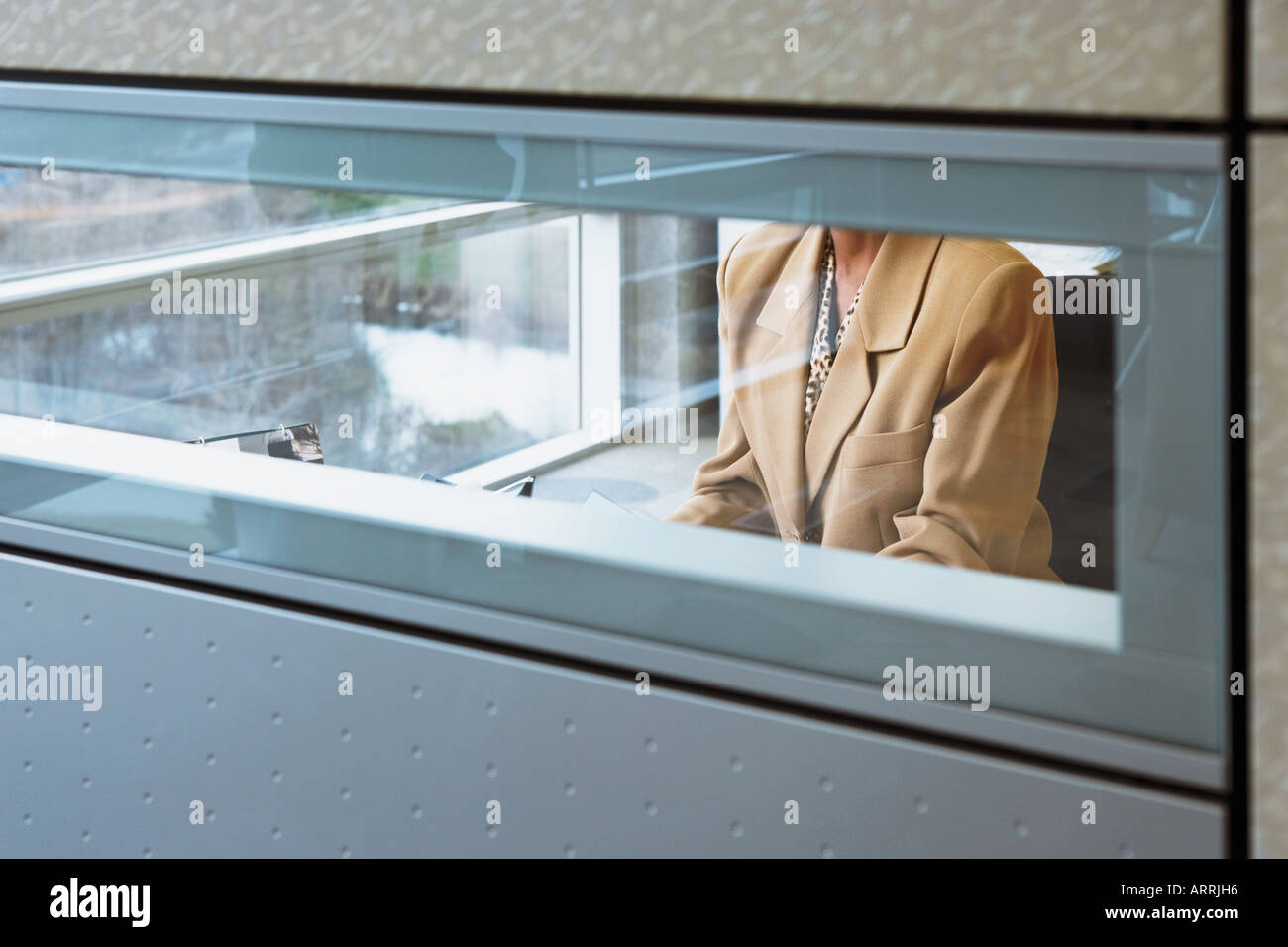 Woman in office cubicle Stock Photo - Alamy