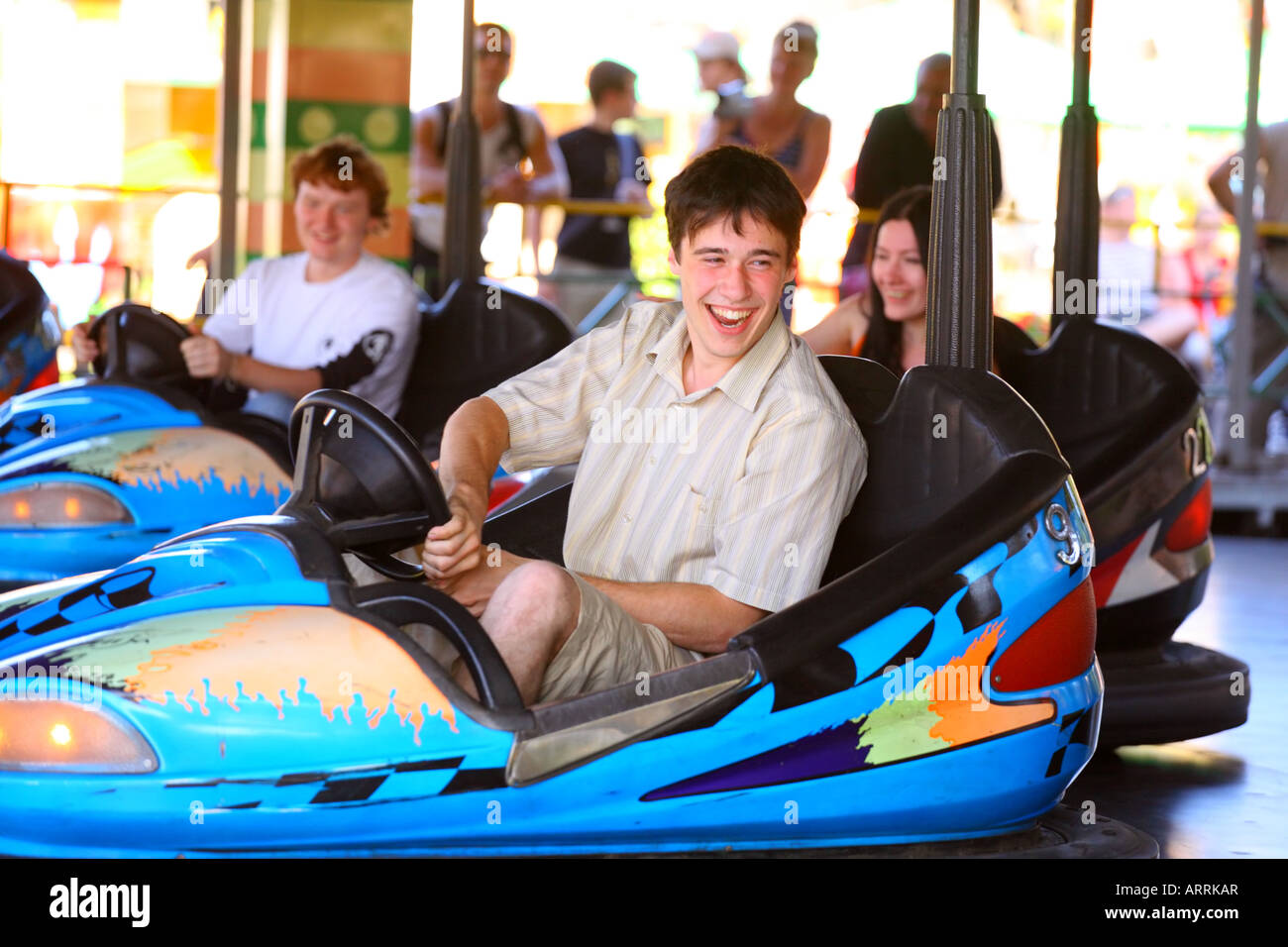 Young people driving bumper cars hi-res stock photography and images ...