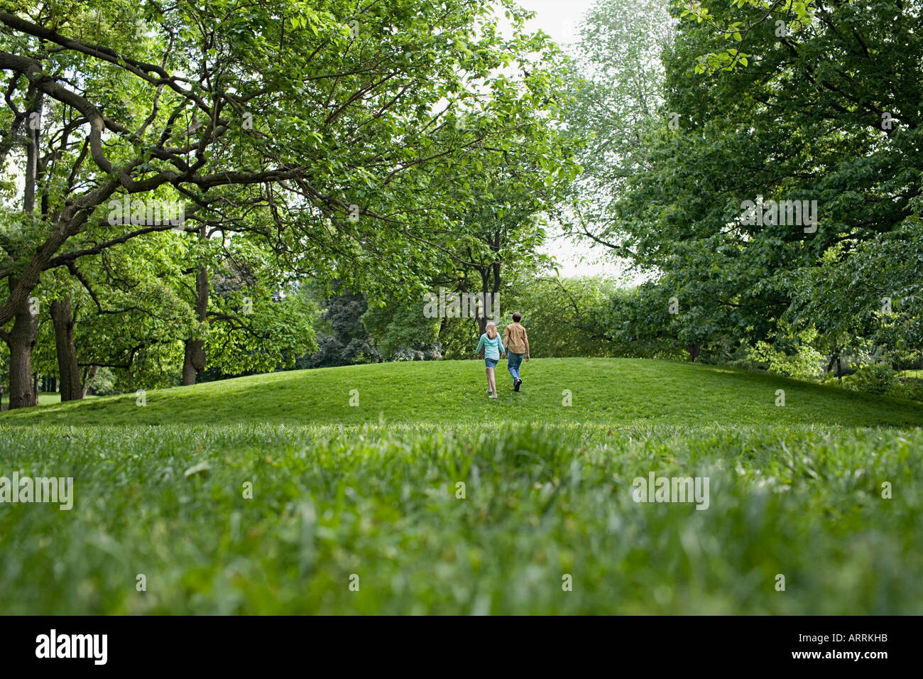 Teenager couple holding hands hill hi-res stock photography and images ...