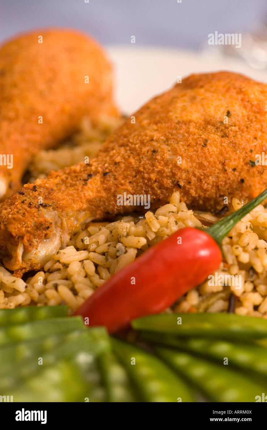 Breaded chicken served on rice Stock Photo - Alamy