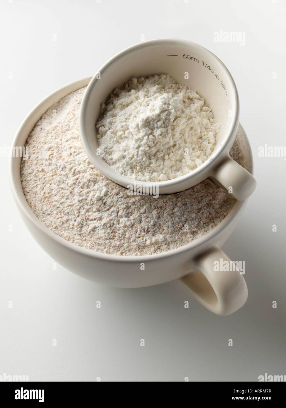 Wholemeal and white flour ingredients on a white background editorial ...