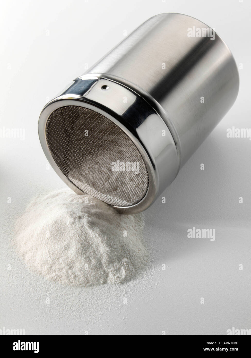 Flour shaker on a white background editorial food Stock Photo - Alamy