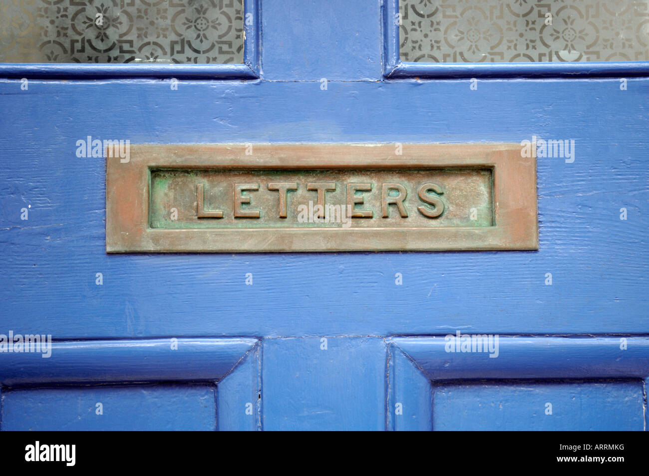 Brass Letterbox in blue wooden door Stock Photo - Alamy