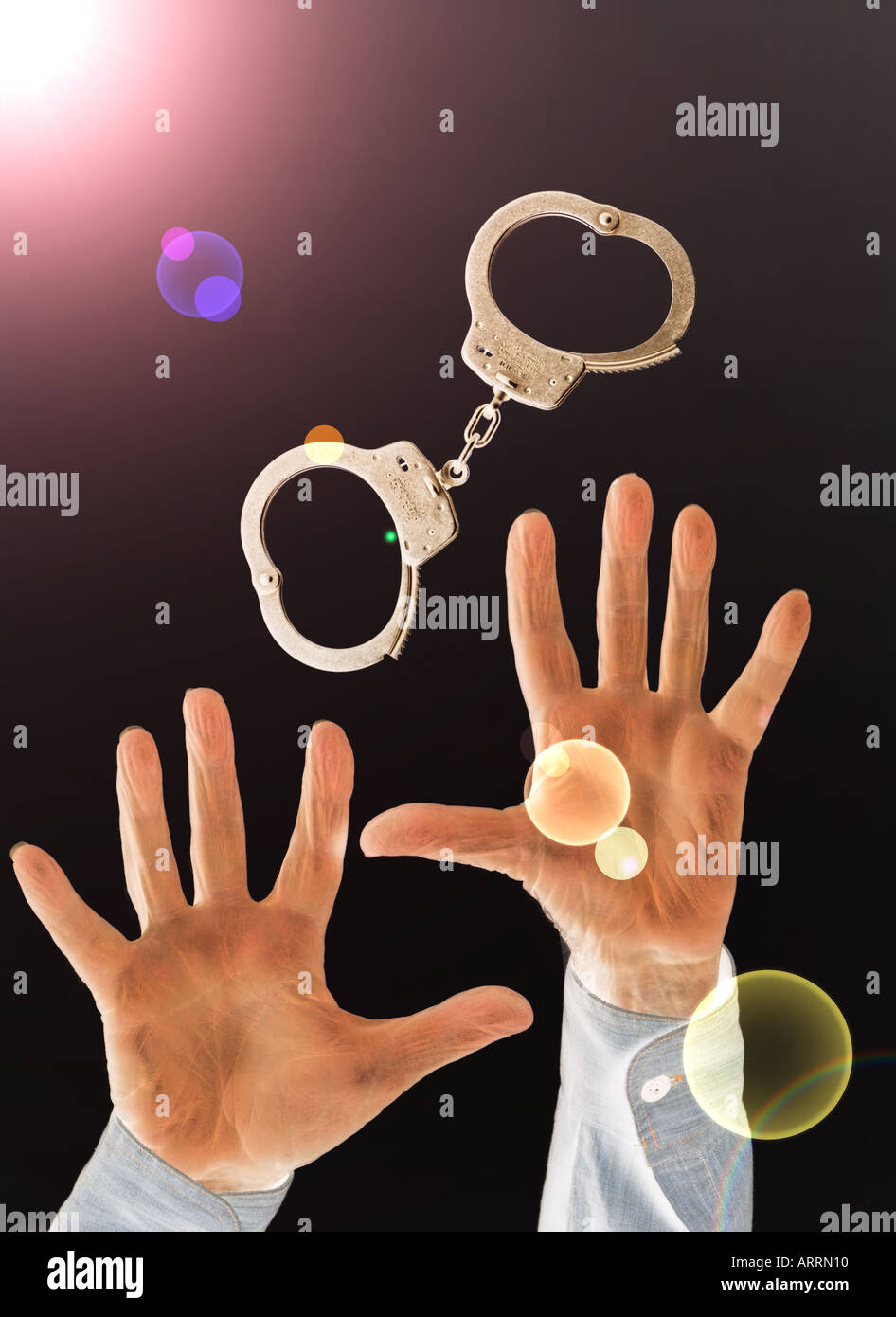 hands tossing handcuffs into air Stock Photo - Alamy