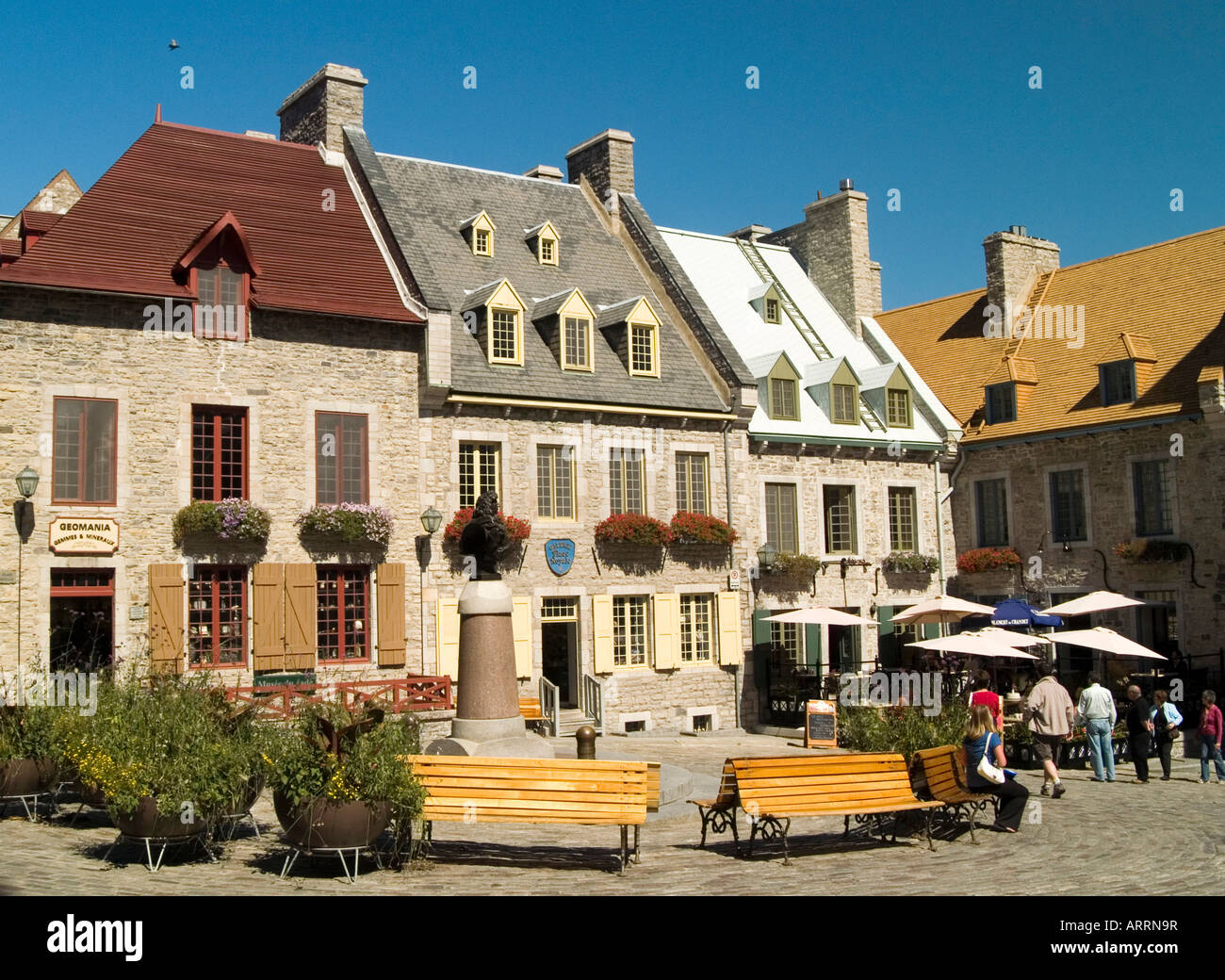 Bright colourful buildings in Place Royale, in the Lower Town area of ...