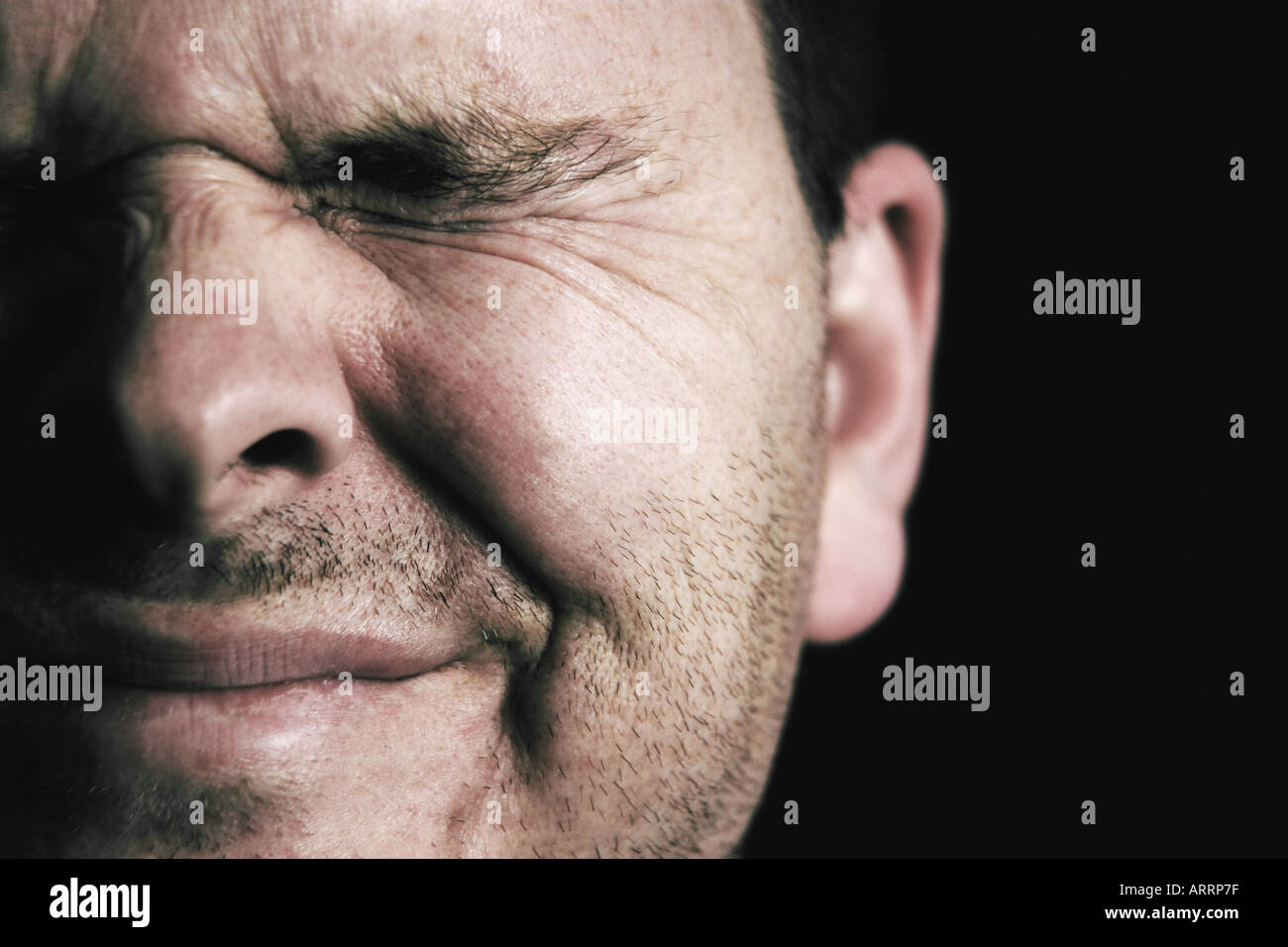 A man contorting his face Stock Photo - Alamy