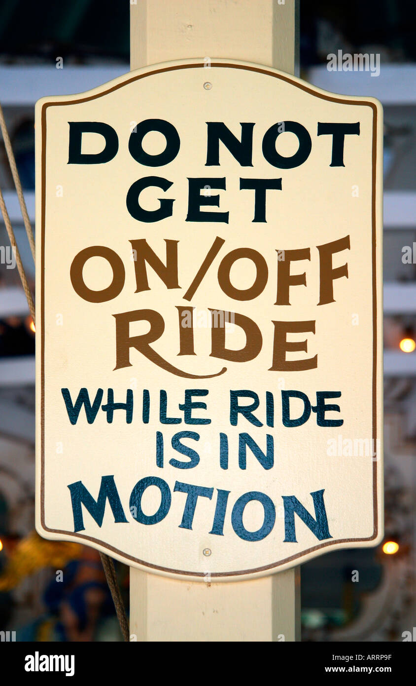 A sign at a merry-go-round Stock Photo - Alamy