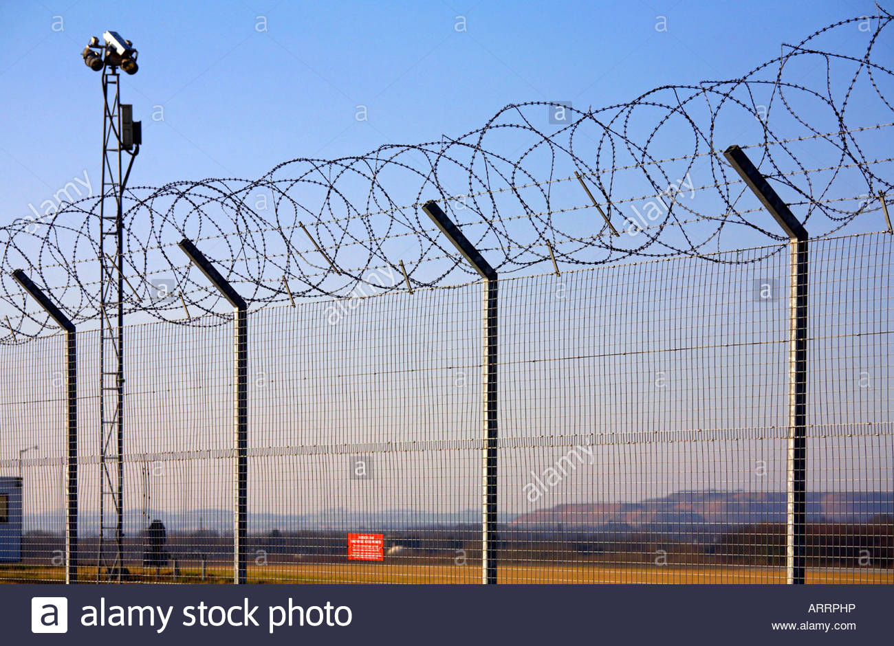 Razor wire fence cctv camera hi-res stock photography and images - Alamy