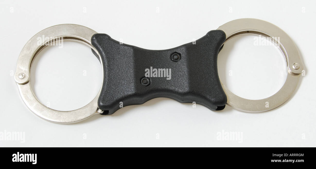 hand cuffs on white back ground Stock Photo - Alamy