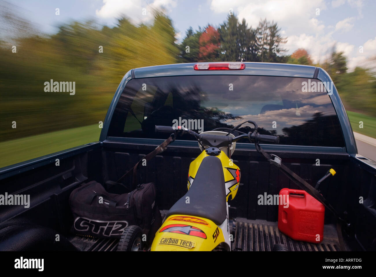 Pickup hauling motorcycle Stock Photo - Alamy