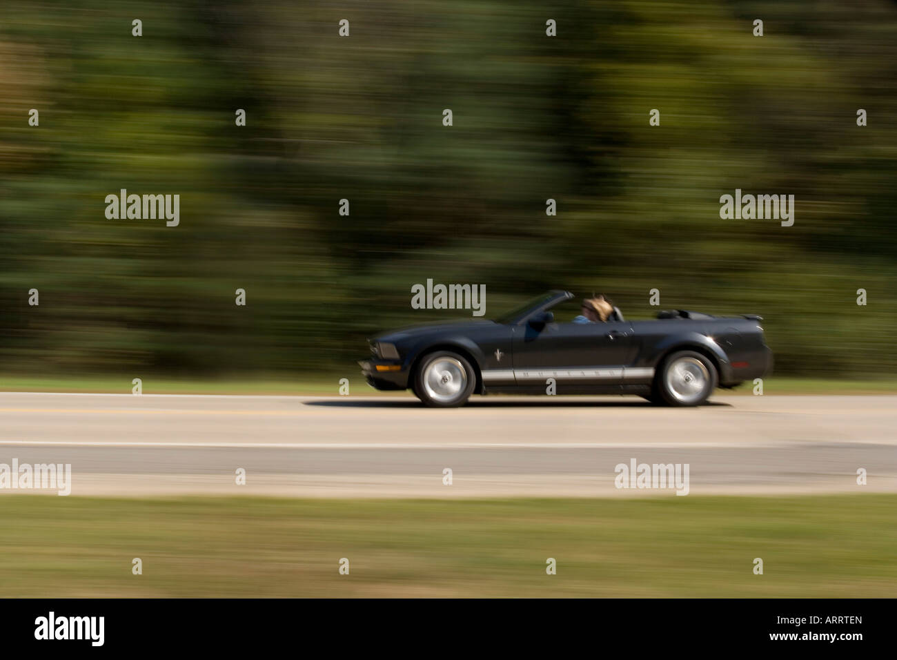 Couple driving in convertible Stock Photo - Alamy