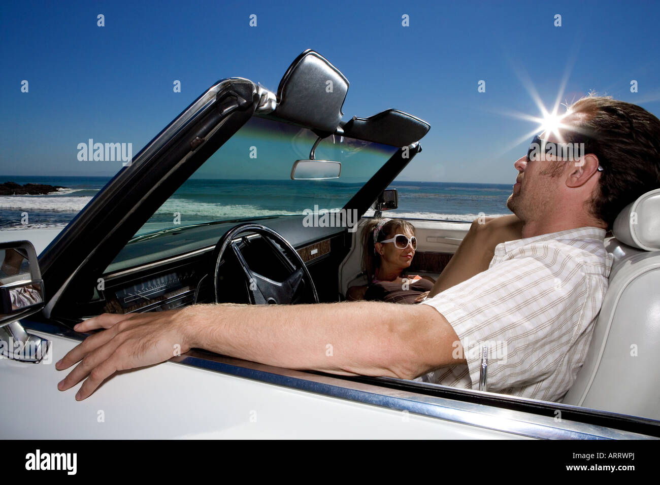 Couple relaxing in car Stock Photo - Alamy