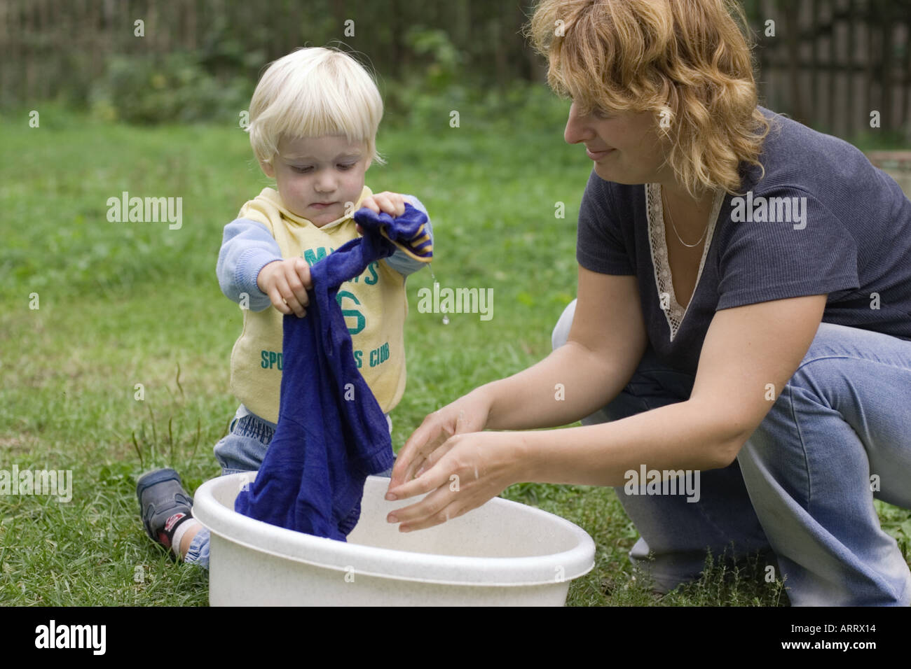 child helping mother Stock Photo - Alamy