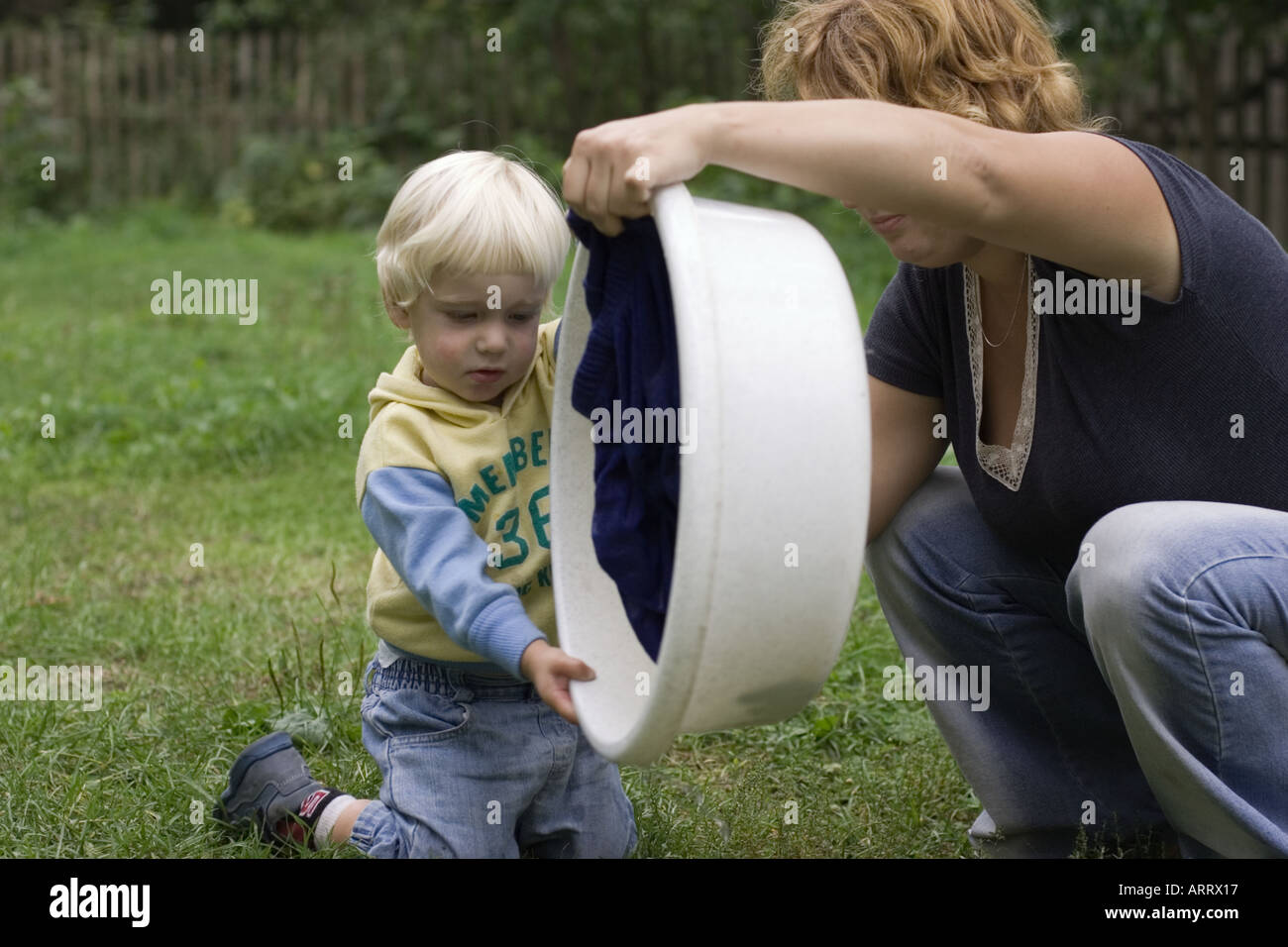 child helping mother Stock Photo - Alamy