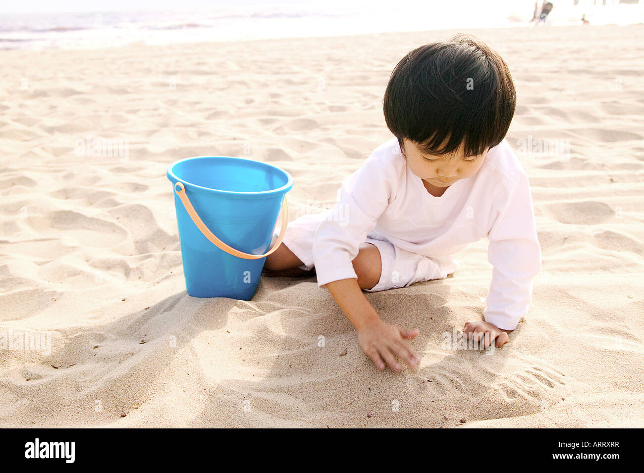 Little Boy Playing in Sand Stock Photo - Alamy