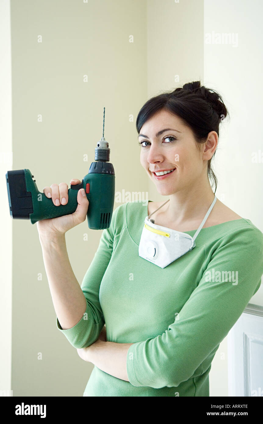 Woman drill tool hi-res stock photography and images - Alamy