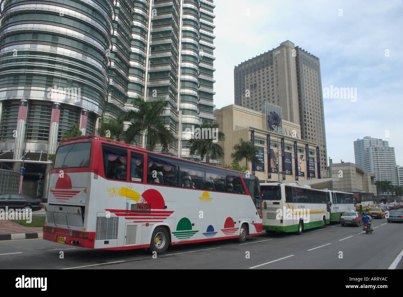 tourist buses outside Suria KLCC shopping centre and Petronas Twin ...